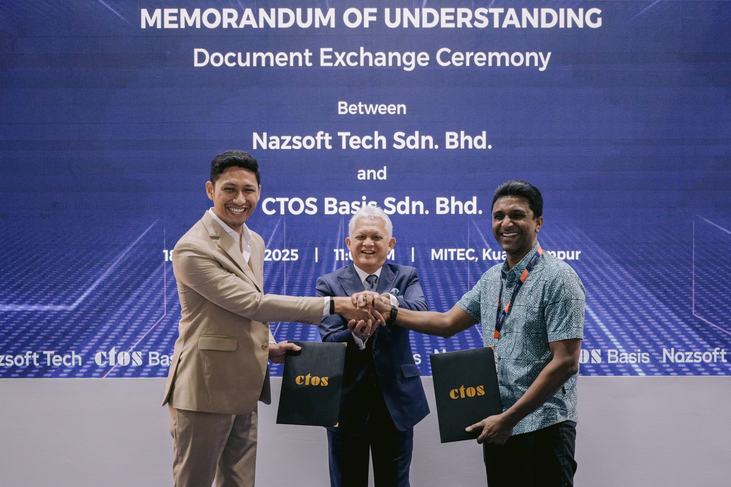 CTOS x MDT MoU Exchange Ceremony @ MIHAS 2025 - MADANI Digital Trade